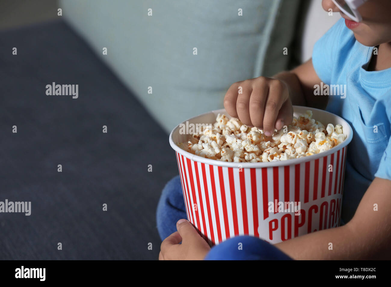 Child eating popcorn hi-res stock photography and images - Alamy