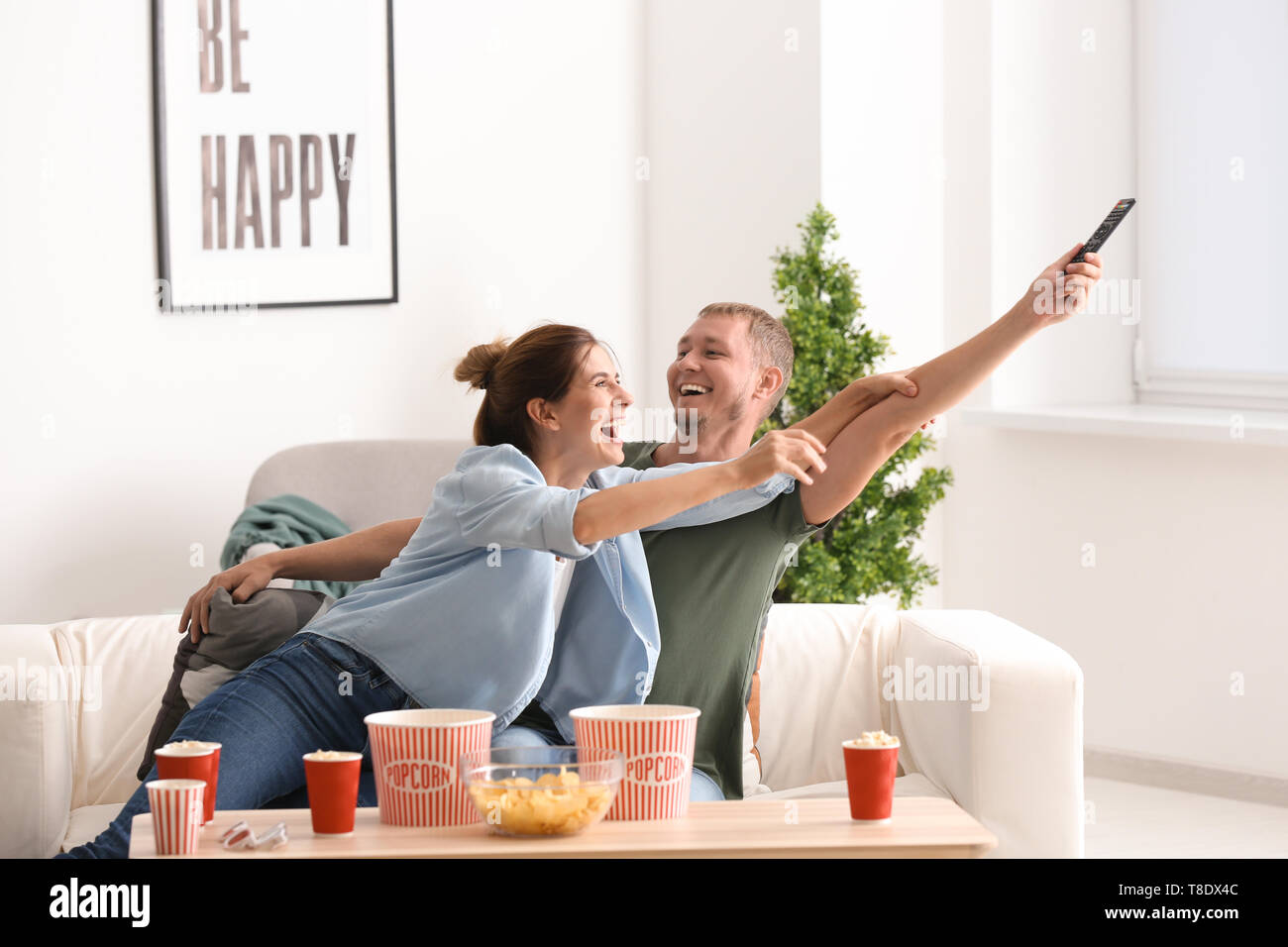 Fighting for the tv remote hi-res stock photography and images - Alamy