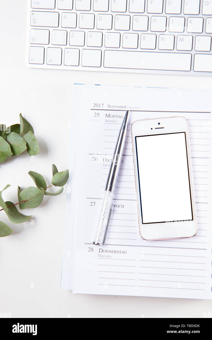 Home office desk with phone Stock Photo - Alamy