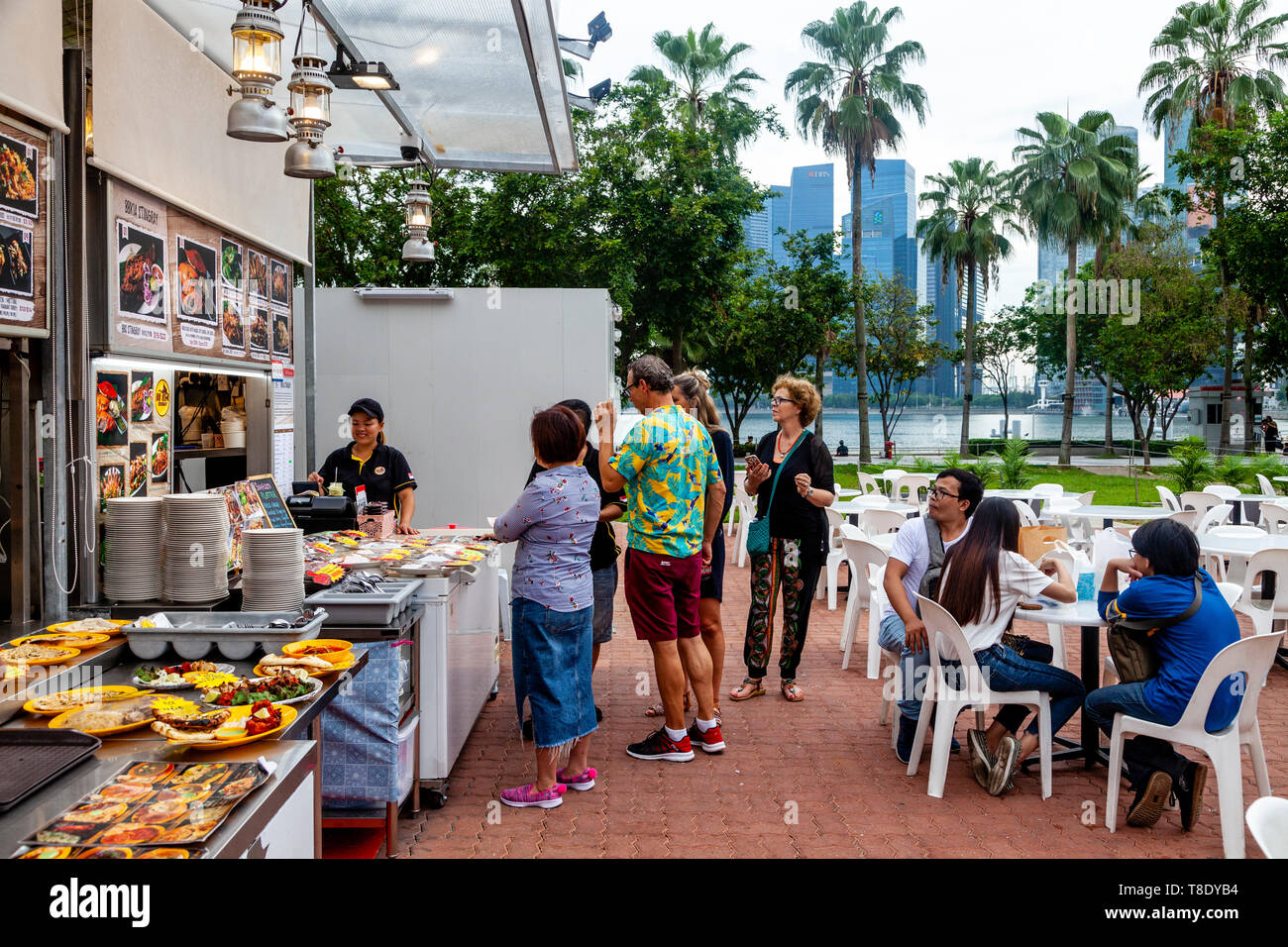 Tourists At An Outside Food Court Near Raffles Avenue, Singapore, South ...