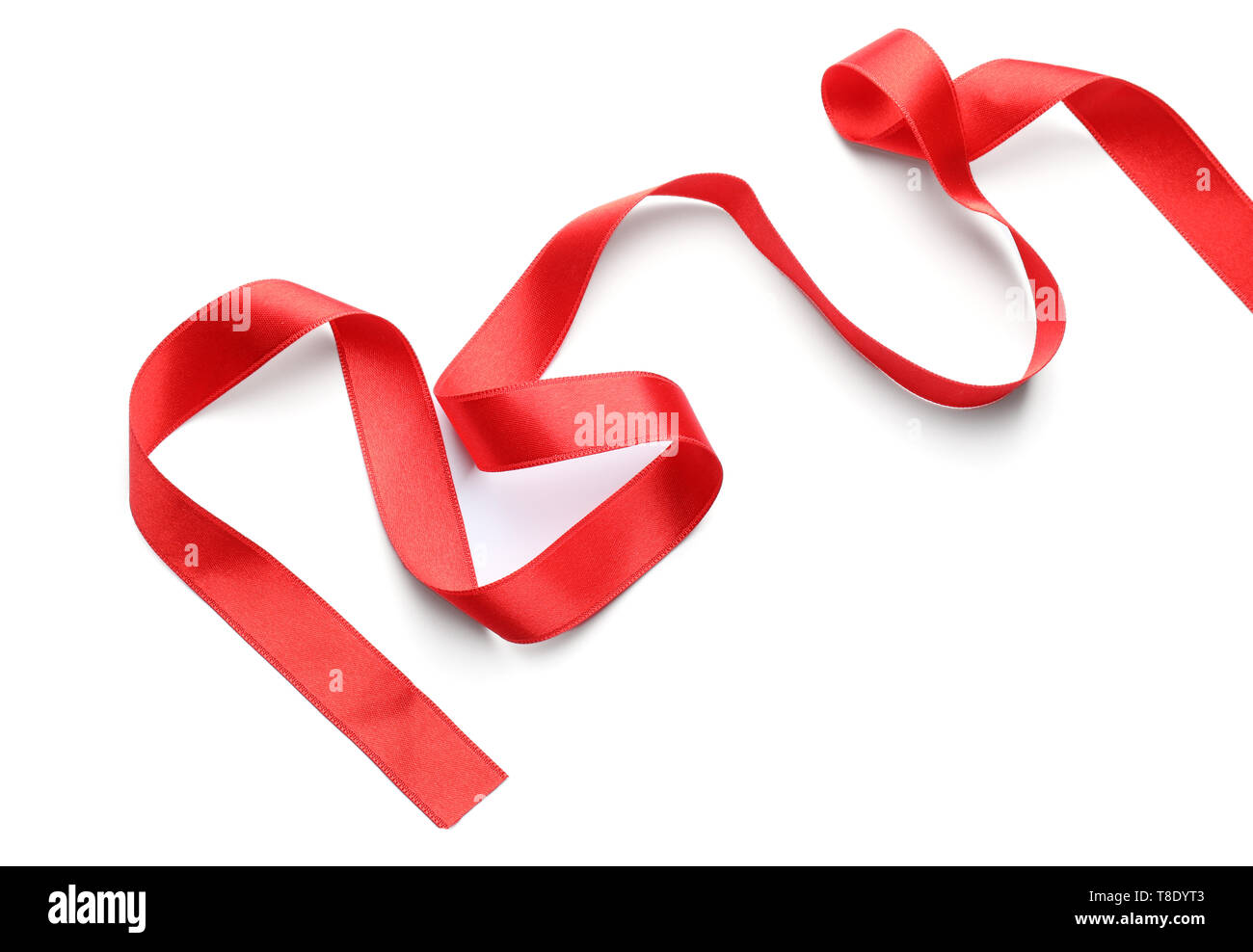 Curled red ribbon on white background Stock Photo - Alamy