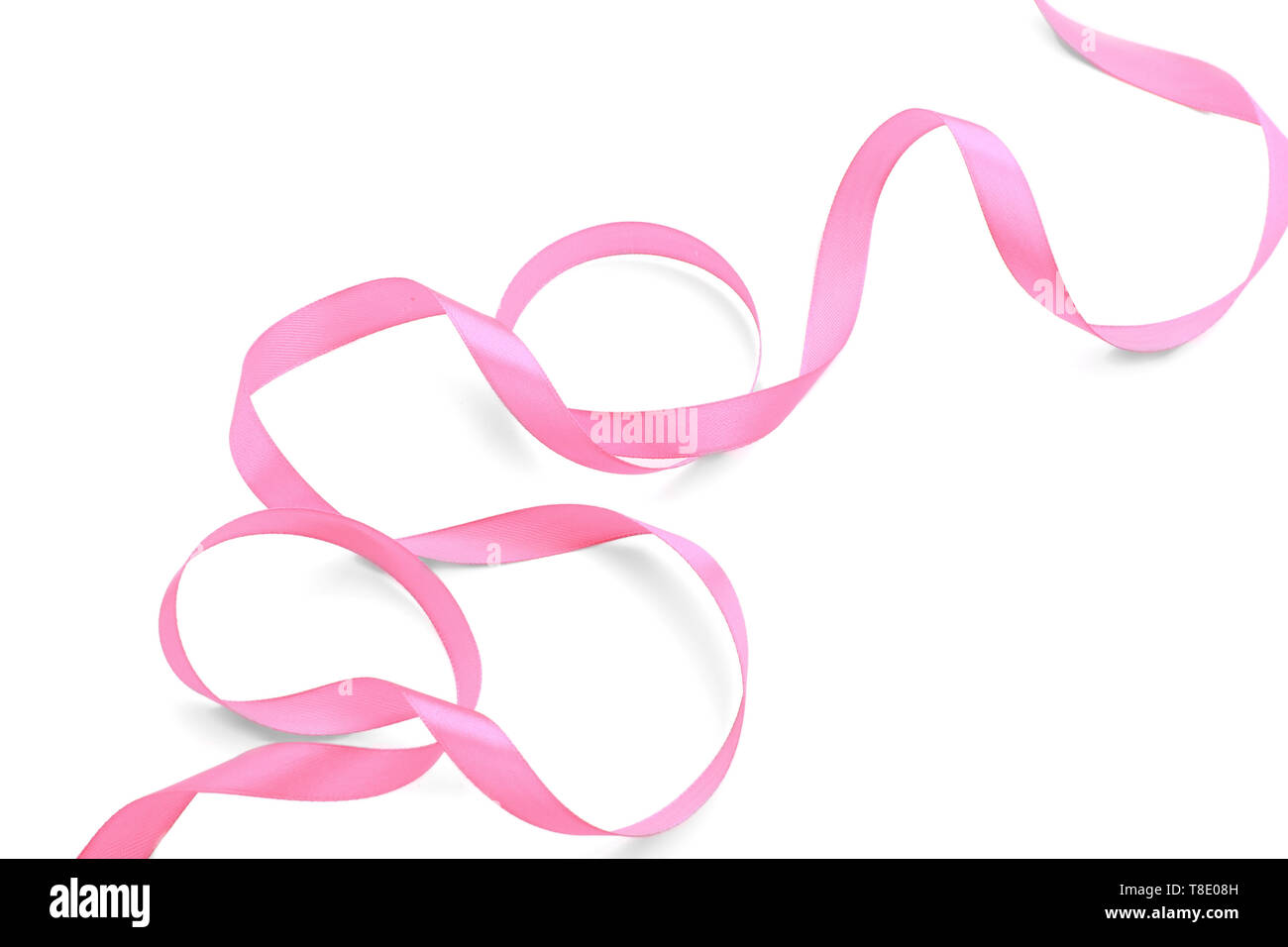 Curled pink ribbon on white background Stock Photo - Alamy