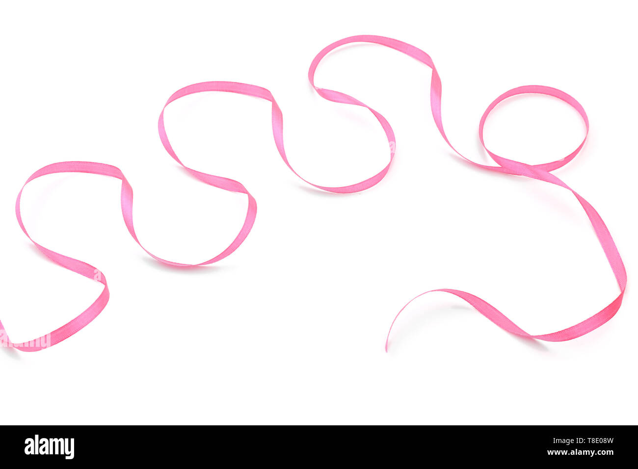 Curled pink ribbon on white background Stock Photo - Alamy