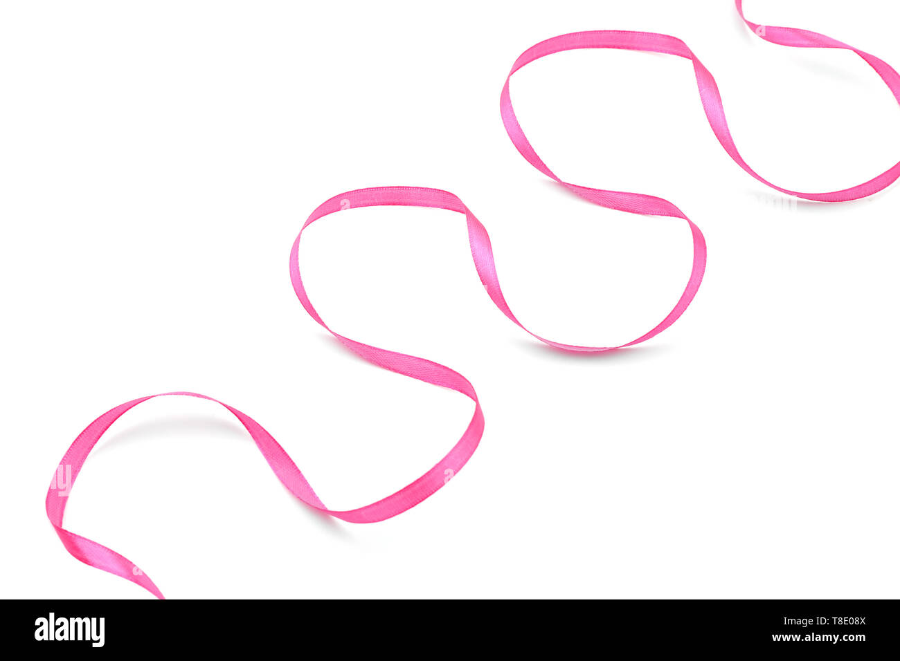 Curled pink ribbon on white background Stock Photo - Alamy
