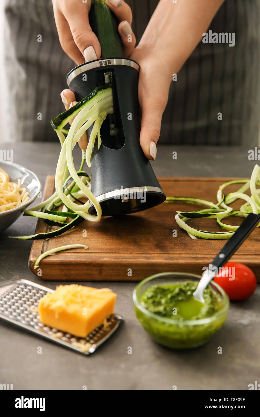 Grating cheese into sauce hi-res stock photography and images - Alamy