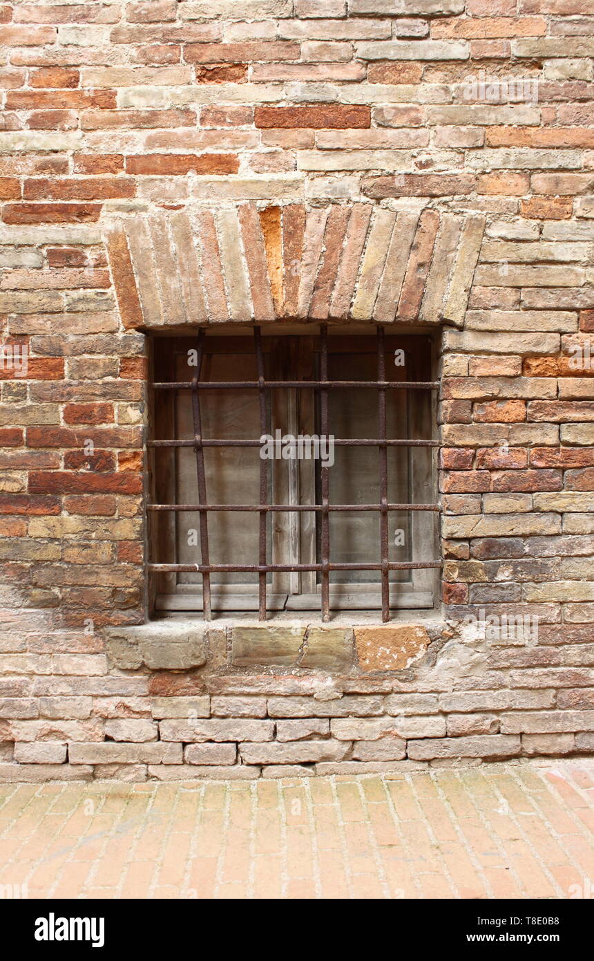 Old medieval window with grate Stock Photo - Alamy