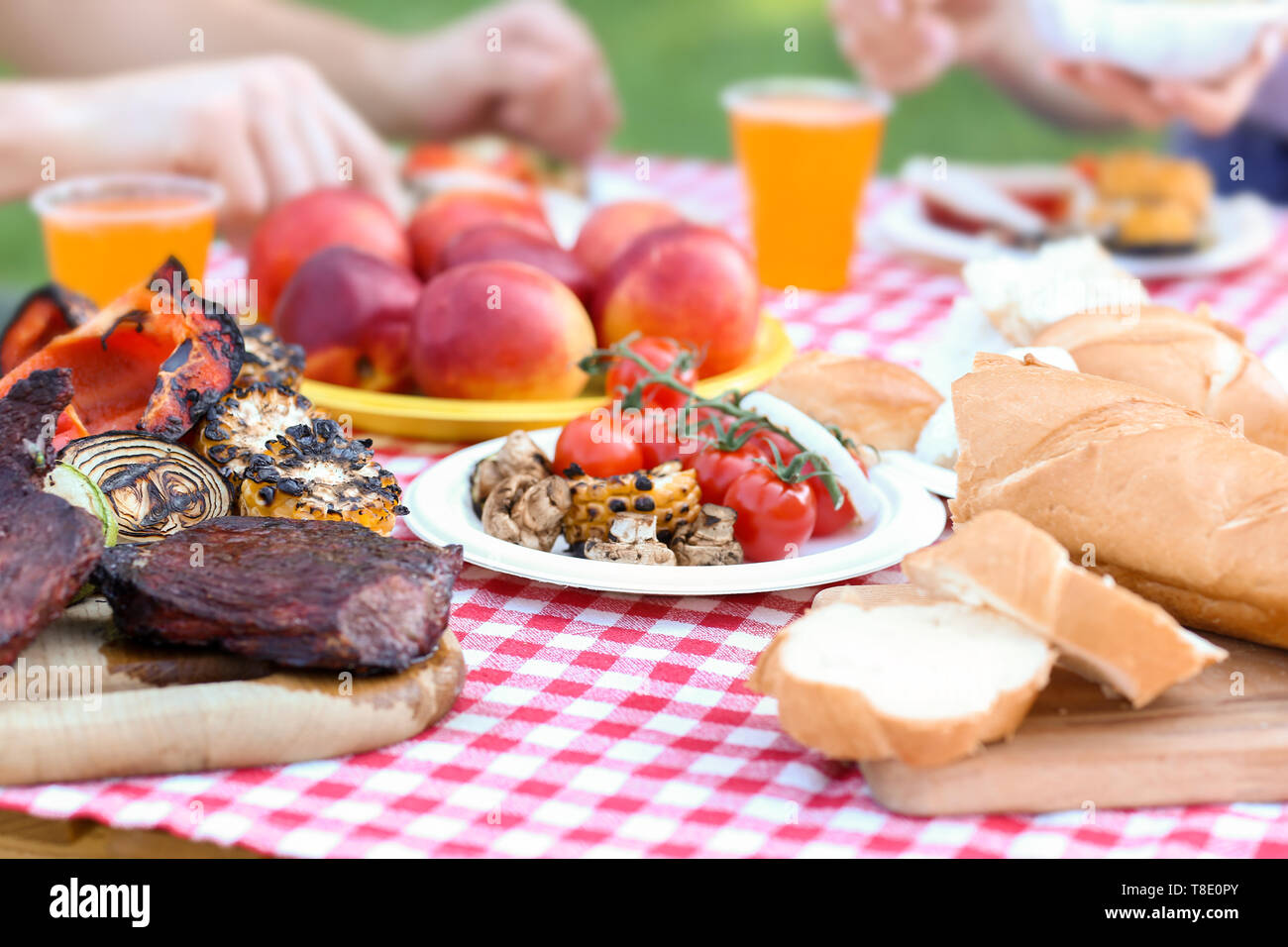 Table with tasty food prepared for summer picnic outdoors Stock Photo ...