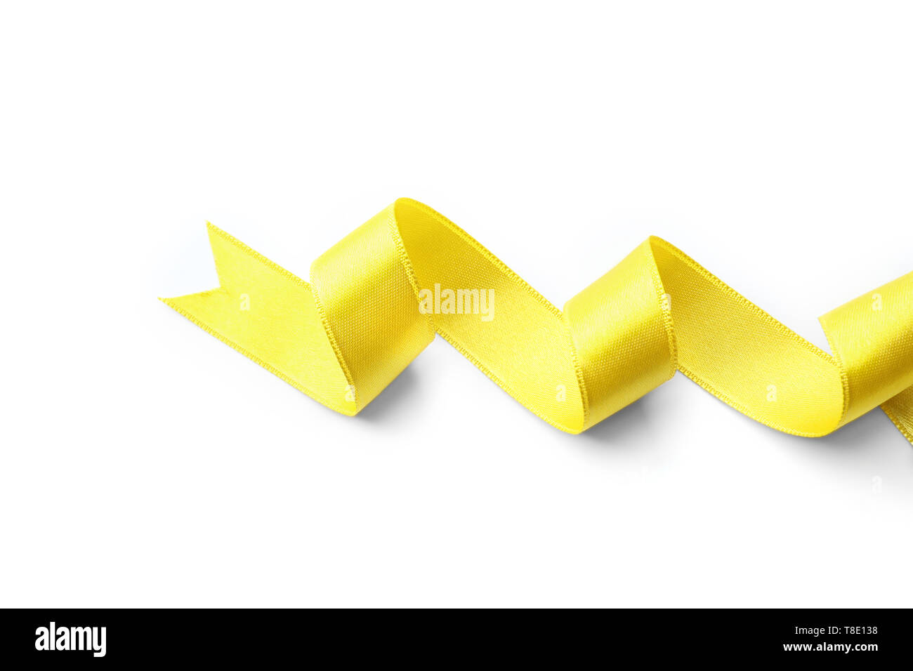 Yellow satin ribbon on white background Stock Photo - Alamy