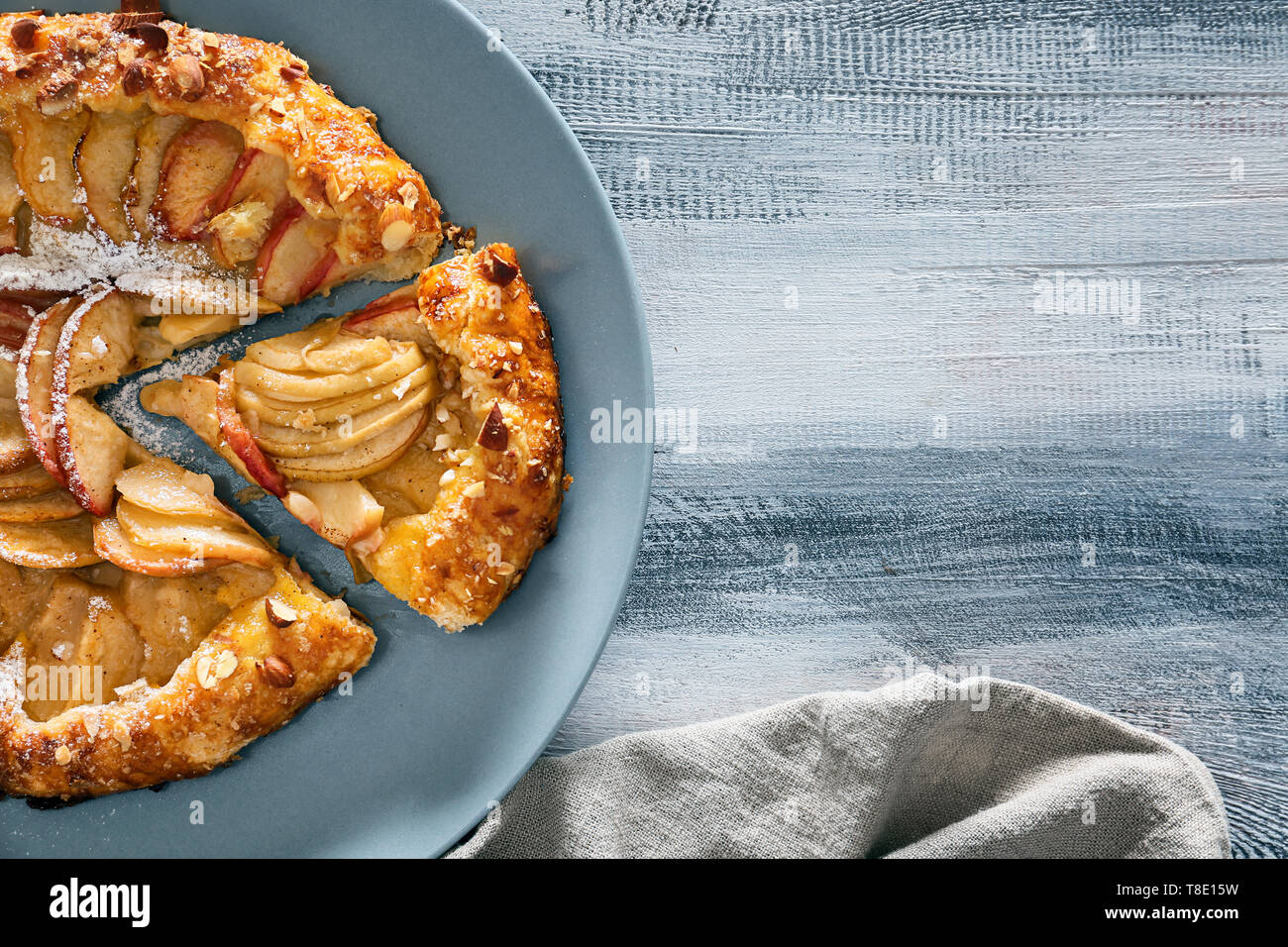 Plate with delicious peach galette on wooden table Stock Photo - Alamy