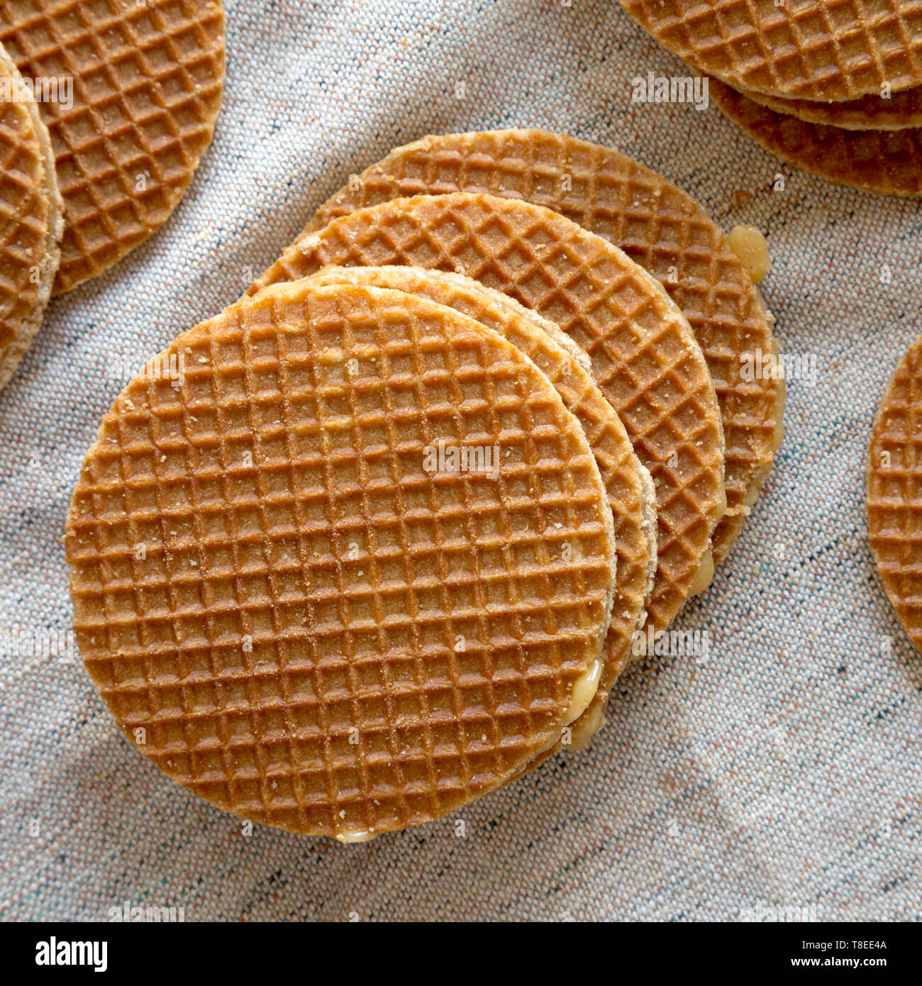 Sweet homemade Dutch stroopwafels with honey-caramel filling on cloth ...