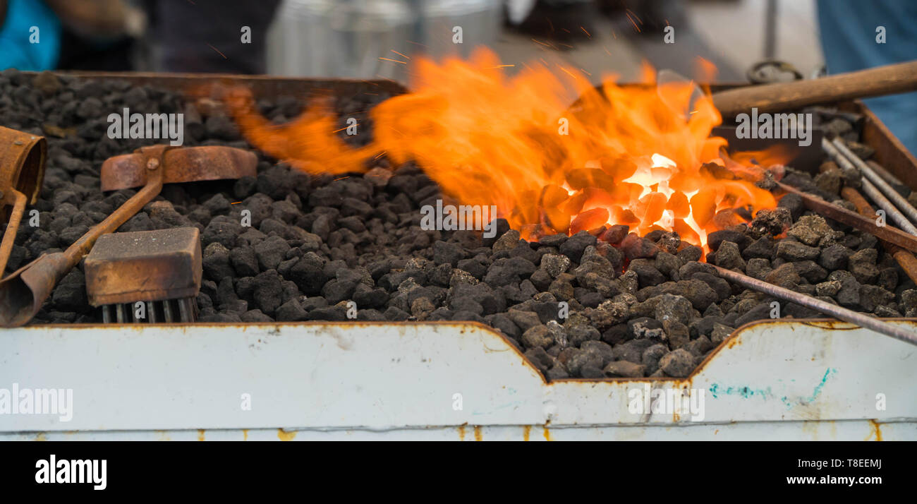 Farrier's furnace with flaming coals and forging tools Stock Photo - Alamy