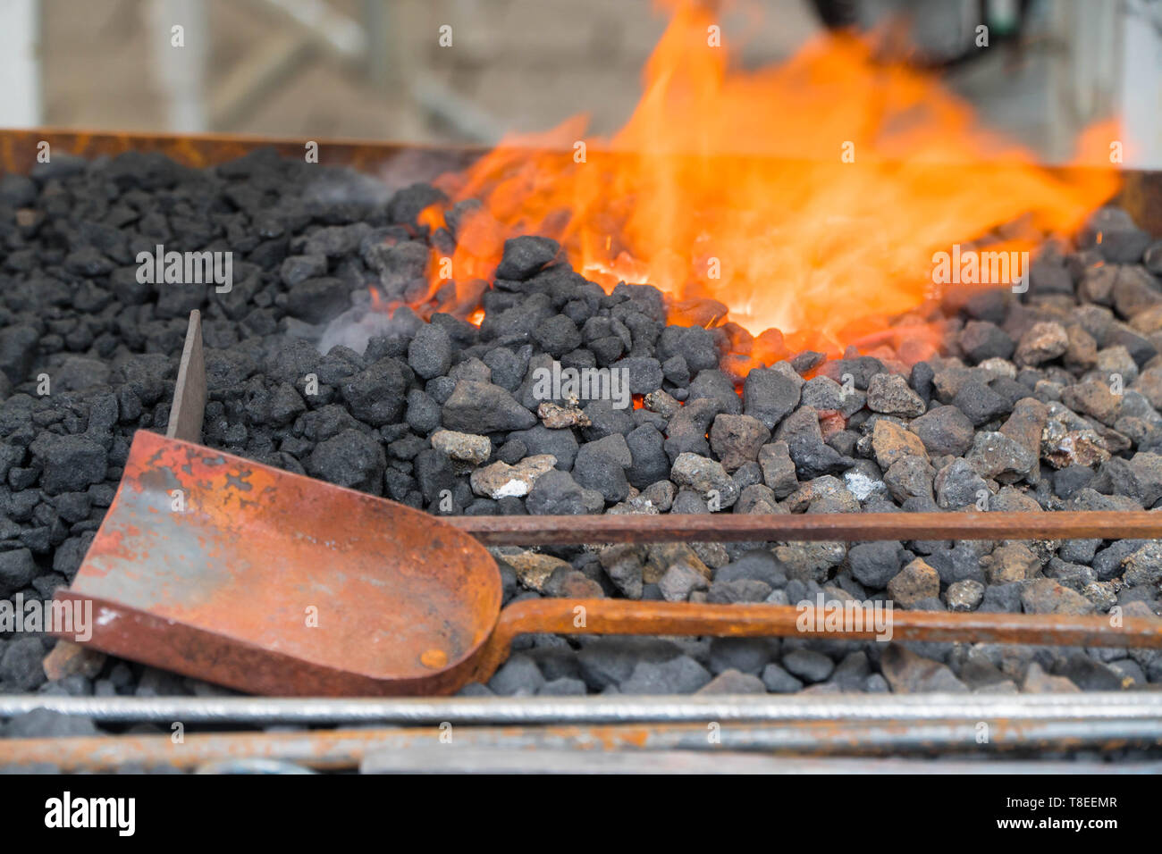 Farrier's furnace with flaming coals and forging tools Stock Photo - Alamy