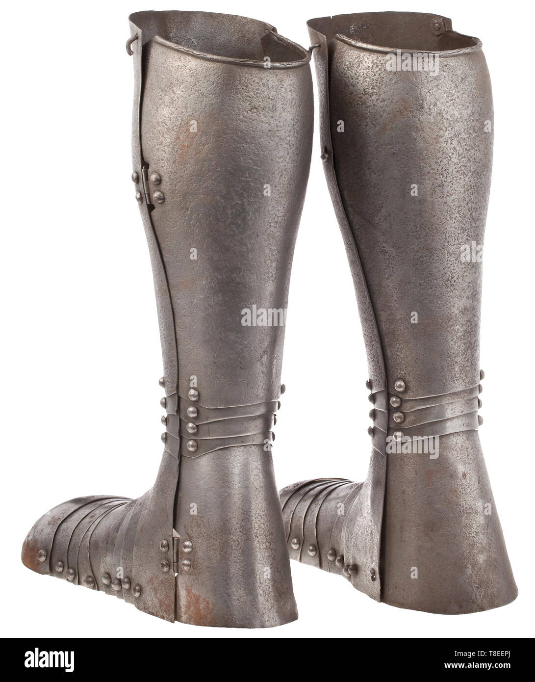 A pair of greaves and sabatons in the style of the second half of the ...