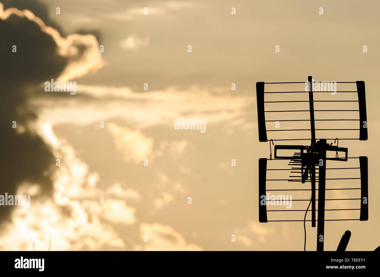 Portable television antenna with sunset sky Stock Photo - Alamy