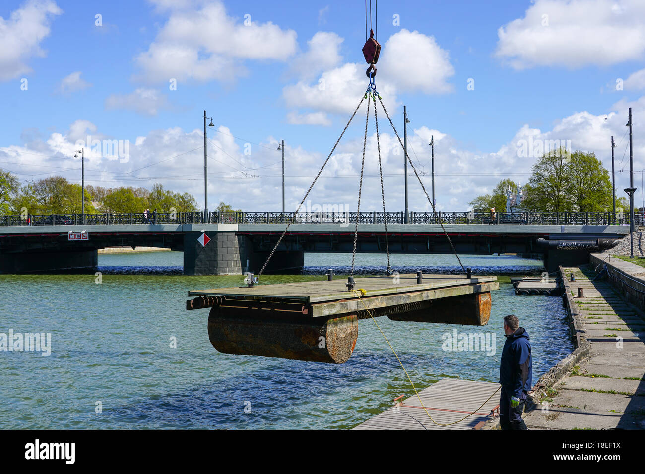 Placing a floating marina pontoon in the water with the help of a crane ...