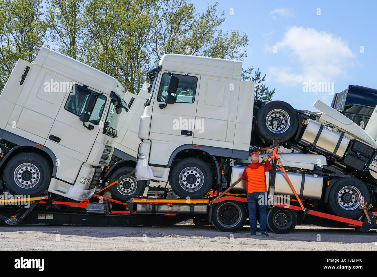 new trucks on a carrier truck, that delivers them to customers Stock ...