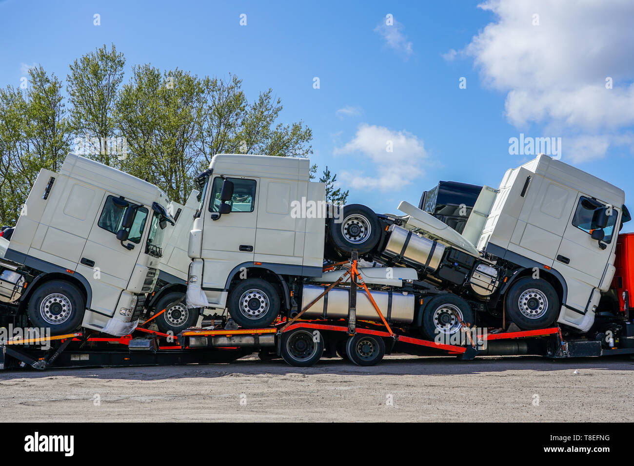 new trucks on a carrier truck, that delivers them to customers Stock Photo - Alamy