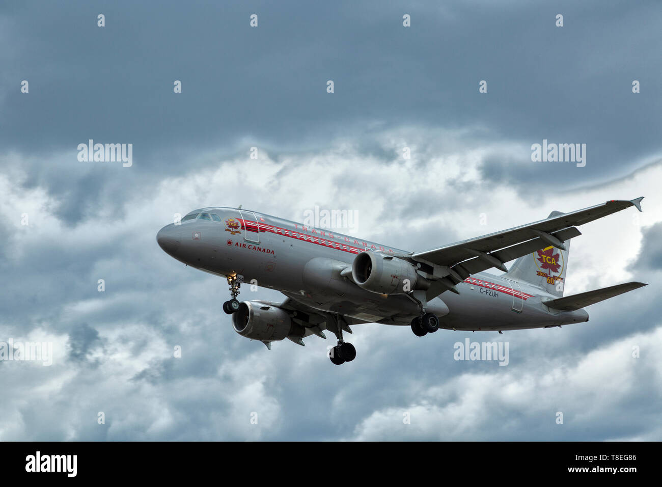 Passenger jet plane landing with wheels down. Toronto Ontario Canada ...