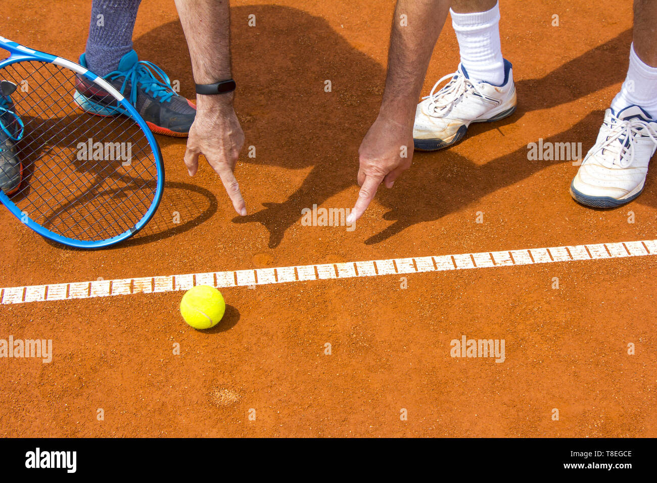 Tennis players shows the track on the tennis court Stock Photo - Alamy