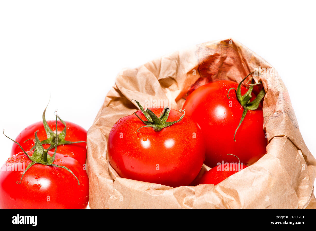 studio photo of freshly harvested tomatoes isolated on white Stock Photo - Alamy