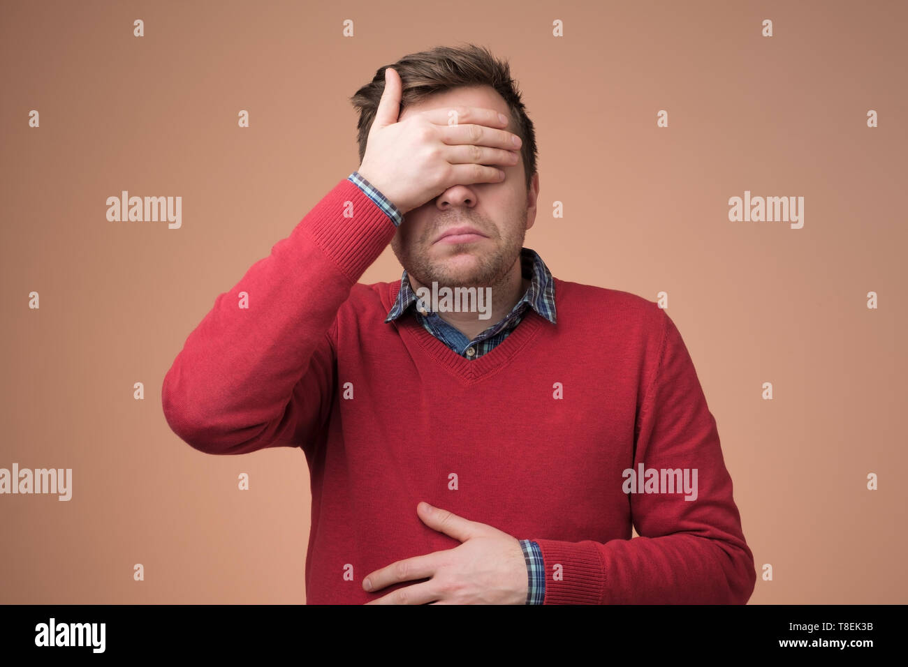 Person trying to hide face with hand hi-res stock photography and ...