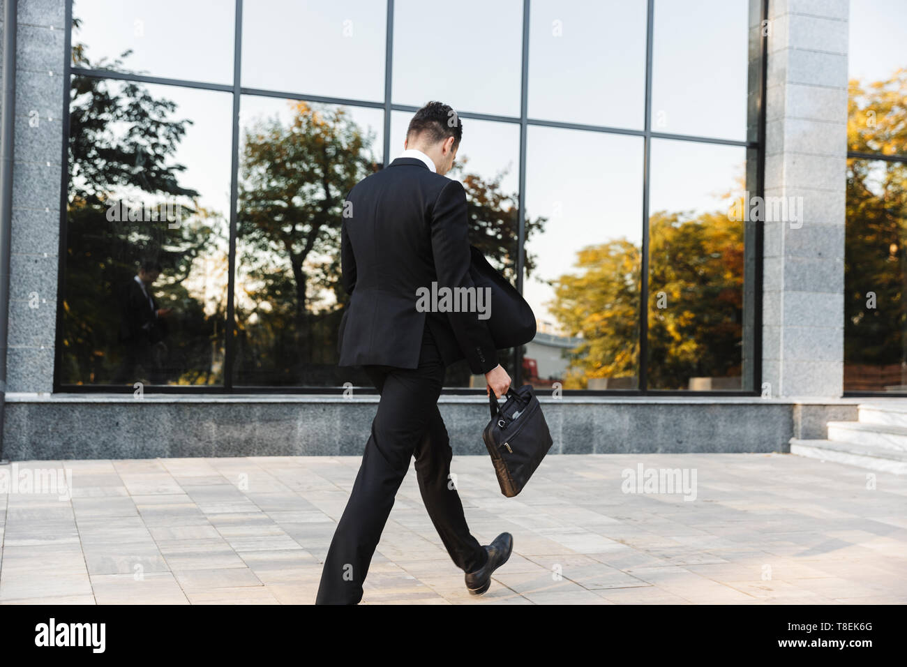 Back view going handsome man hi-res stock photography and images - Alamy