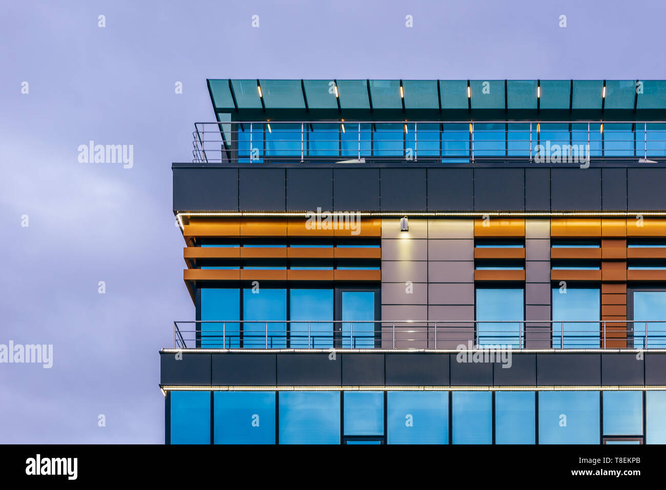 Modern high-rise office building with a glass facade at overcast ...