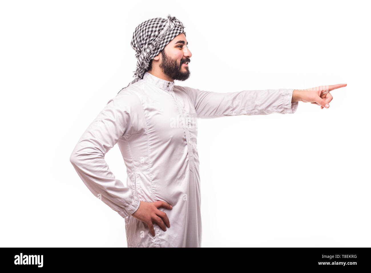 Young arab man pointed side wearing in traditional abaya clothes on ...