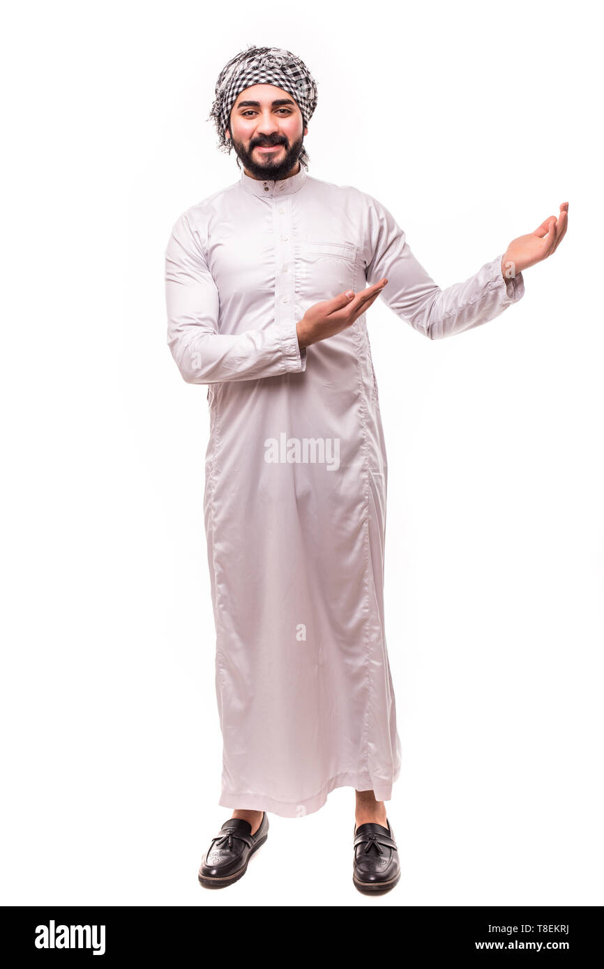 Young arab man pointed side wearing in traditional abaya clothes ...