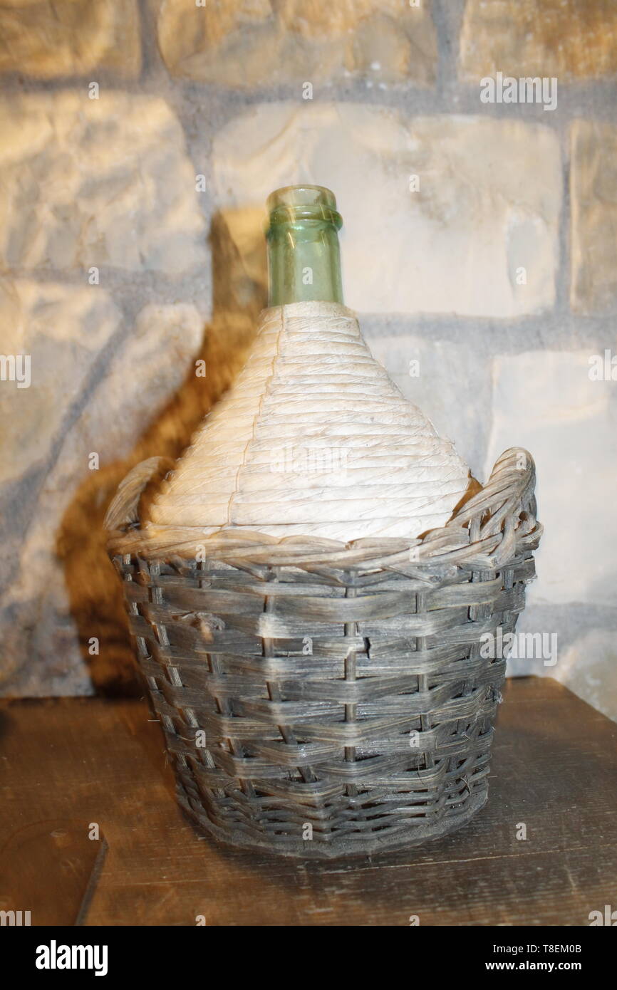 Wine cellar interior with old round flask Stock Photo - Alamy