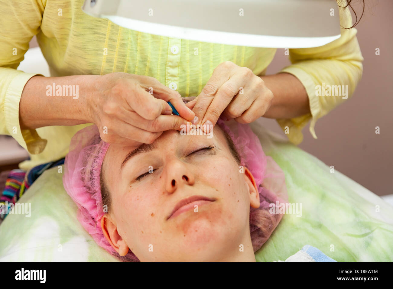 Body piercing procedure hi-res stock photography and images - Alamy