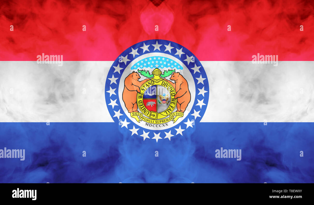 The national flag of the US state Missouri in against a gray smoke on ...