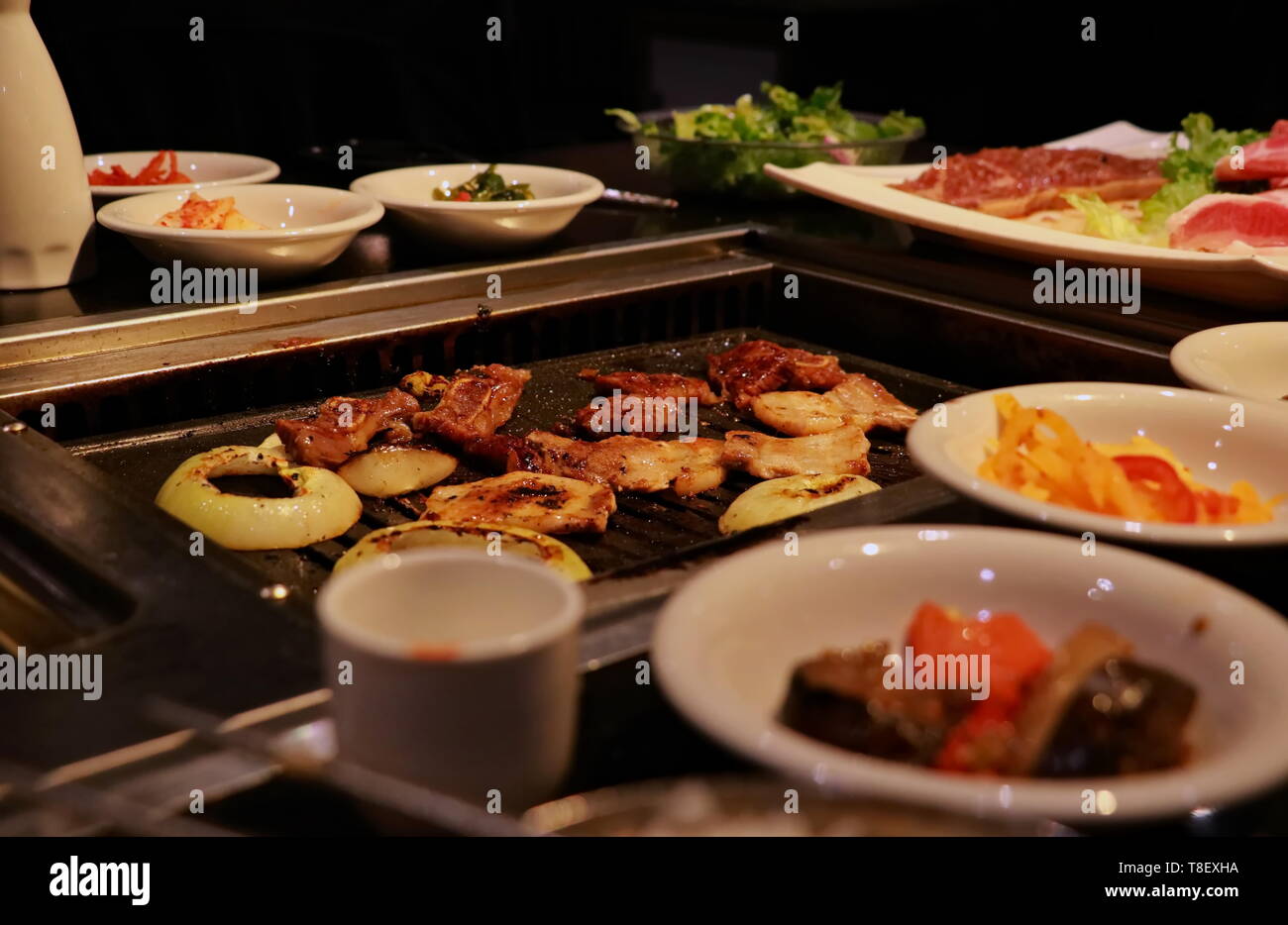 Pork belly and beef short ribs on the grill (KBBQ Stock Photo - Alamy