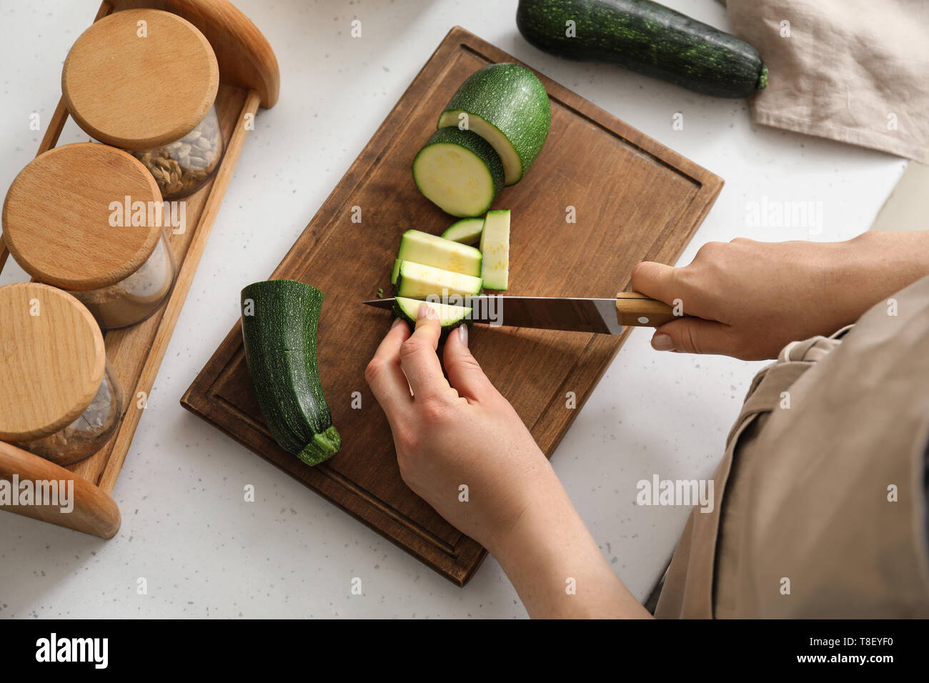Person cooking sliced zucchini in hi-res stock photography and images ...