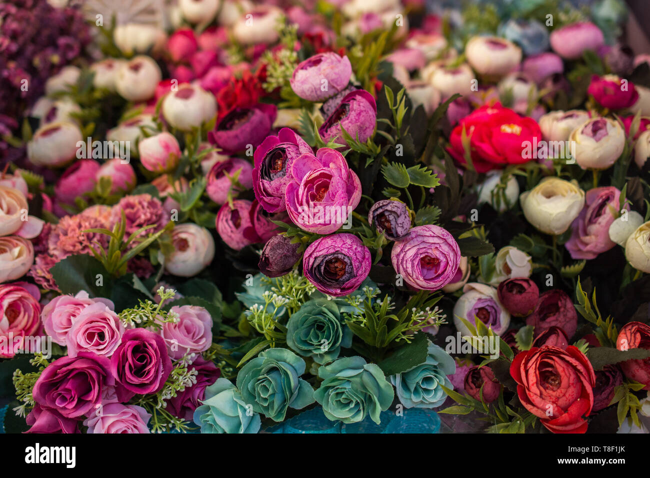 Fake colorful flowers for decorative purposes Stock Photo - Alamy