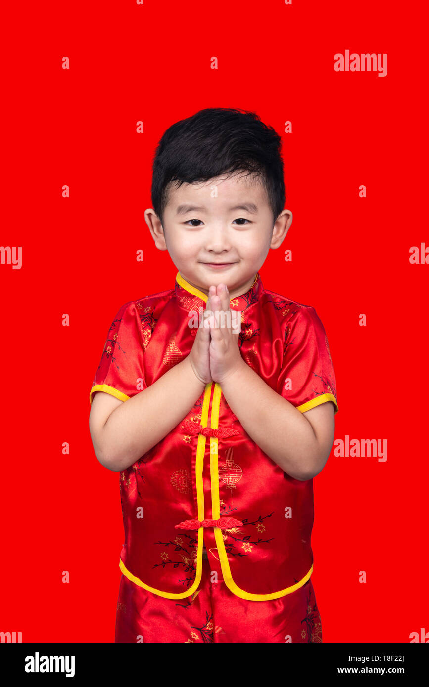 Chinese New Year Concept, Cute Asian boy in red traditional Chinese ...