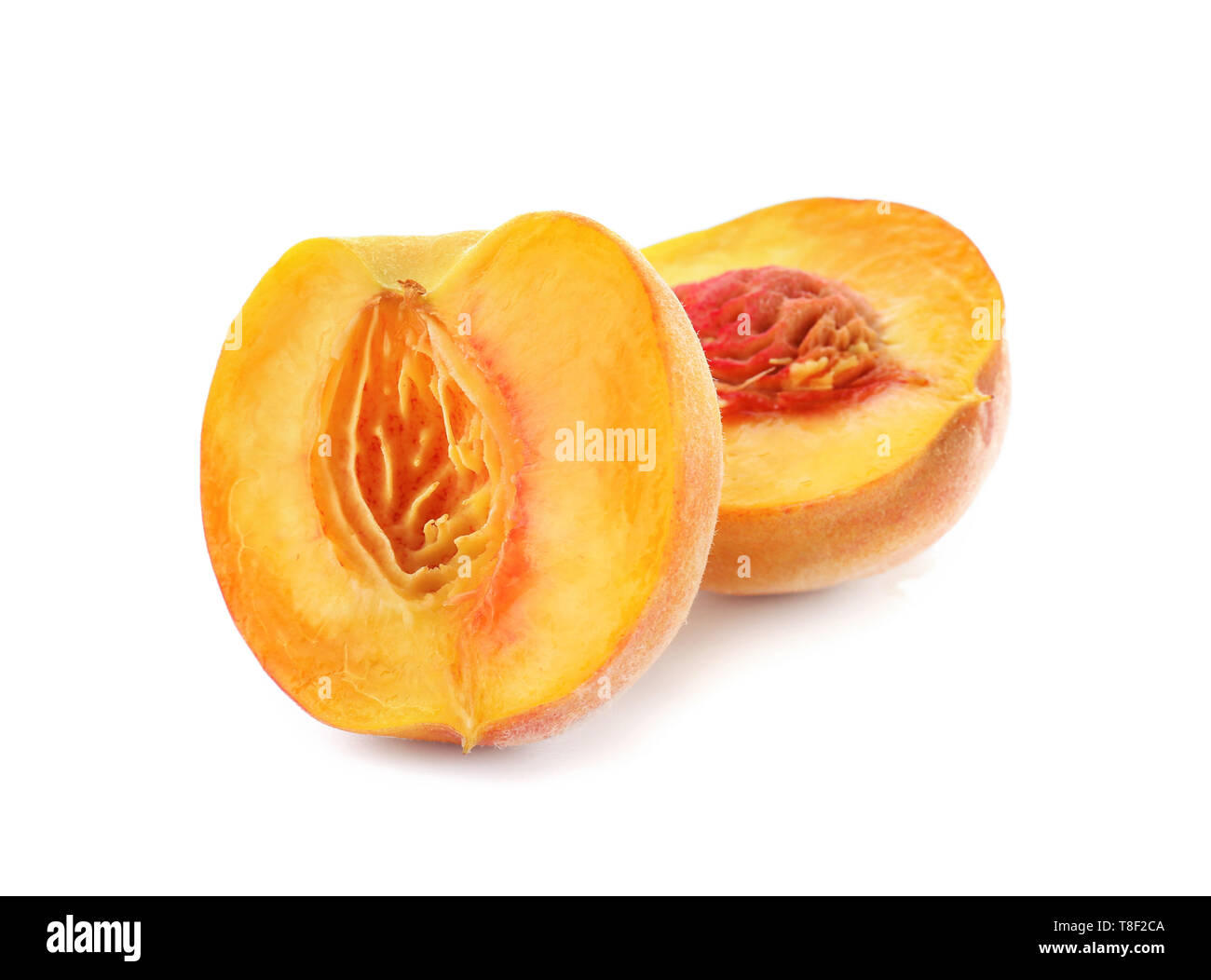 Fresh cut peach on white background Stock Photo - Alamy