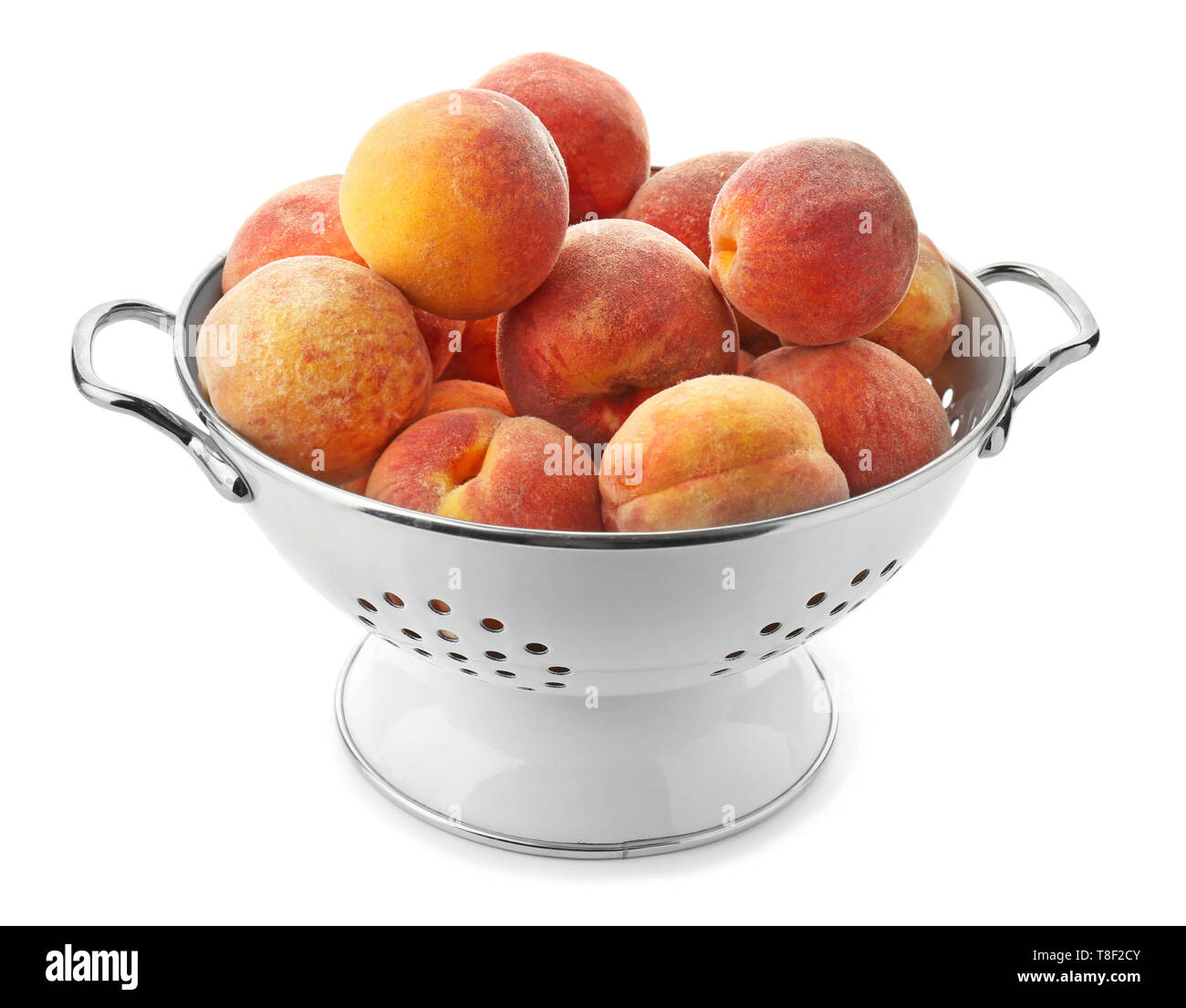 Colander with fresh peaches on white background Stock Photo - Alamy