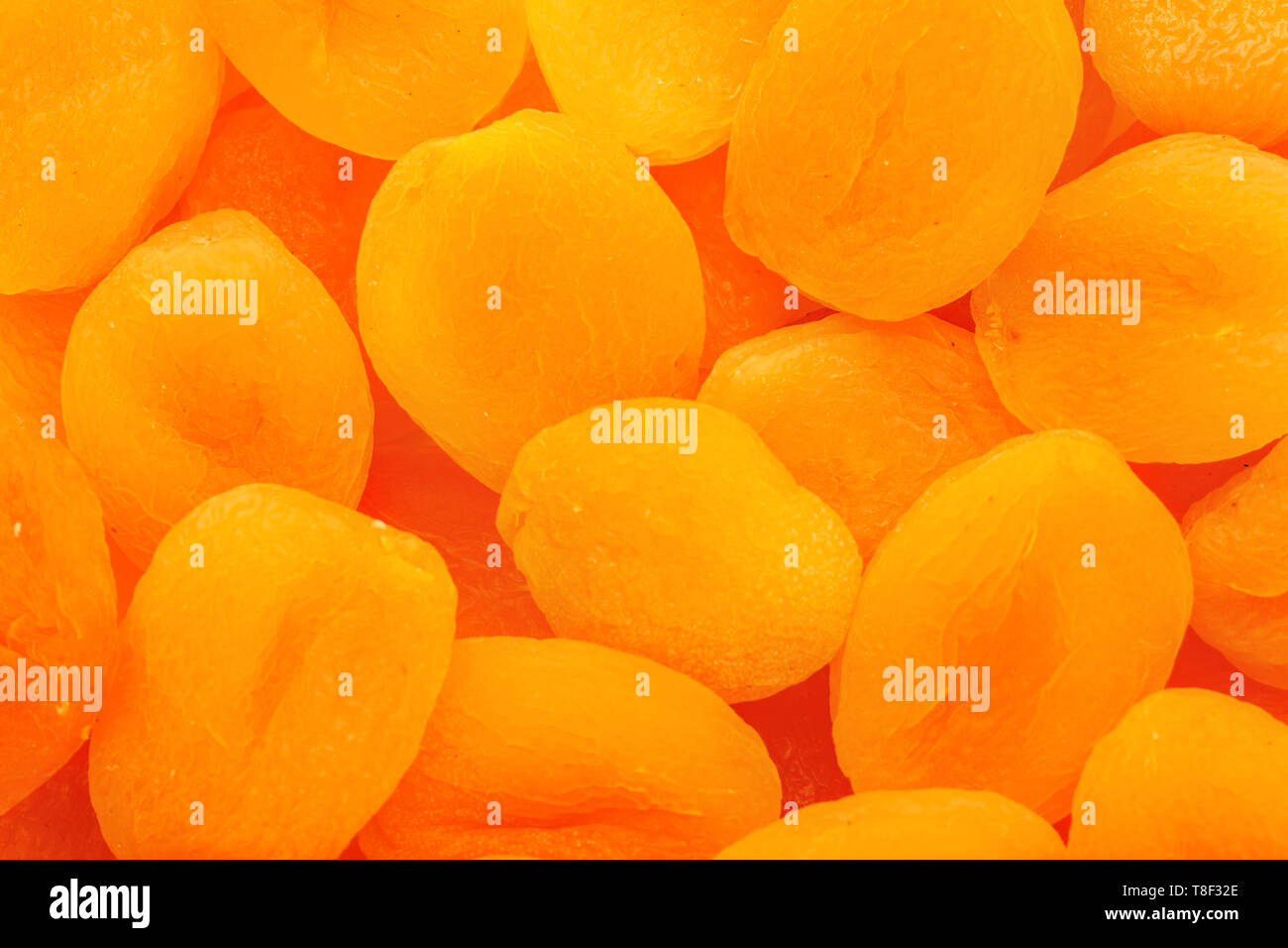 Dried apricots as background Stock Photo - Alamy