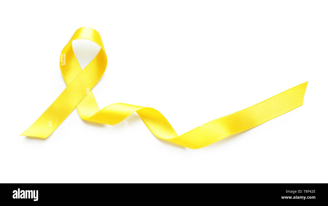 Yellow ribbon on white background. Cancer awareness concept Stock Photo ...