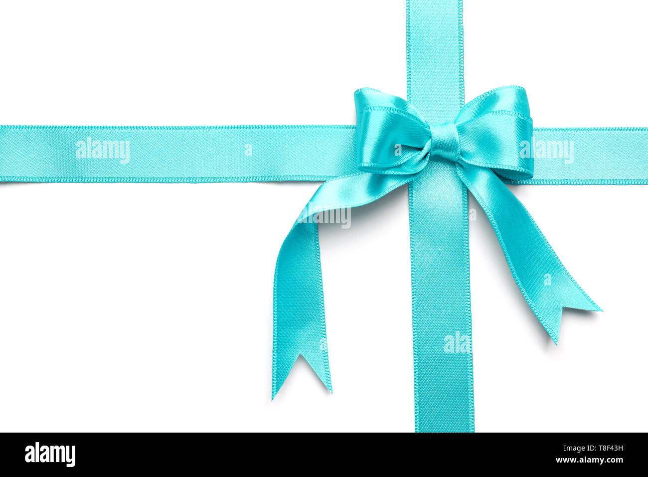 Turquoise satin ribbons with bow on white background Stock Photo - Alamy