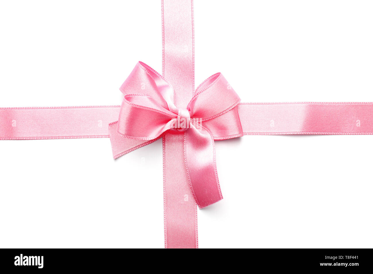 Pink satin ribbons with bow on white background Stock Photo - Alamy