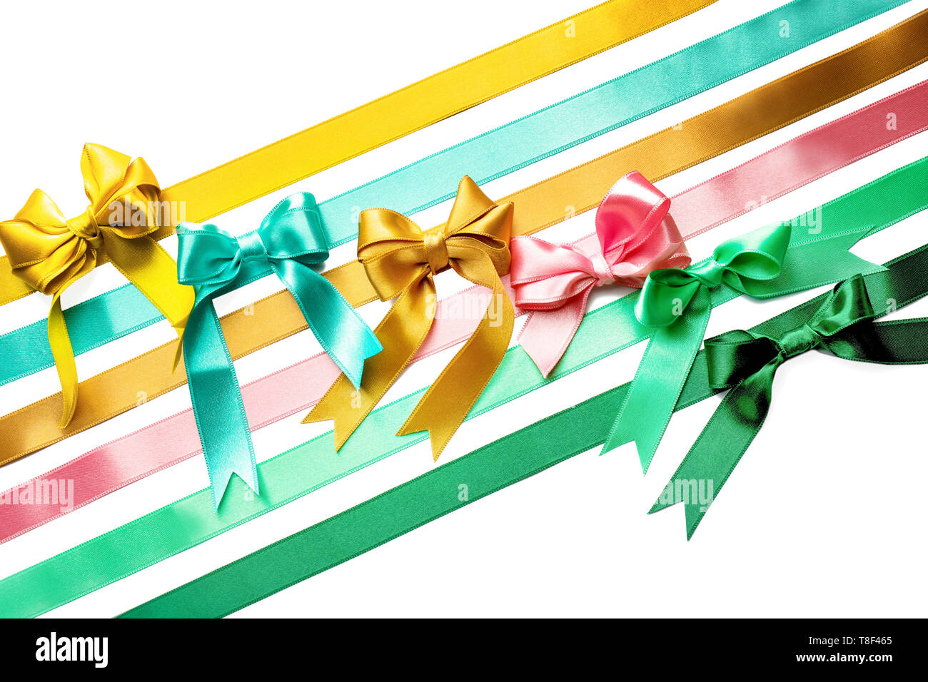 Color satin ribbons with bows on white background Stock Photo - Alamy