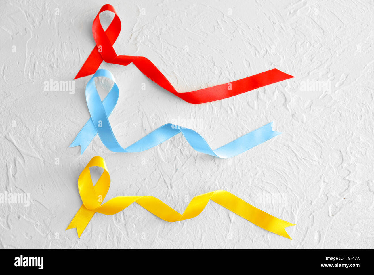 Different ribbons on light background. Cancer awareness concept Stock ...