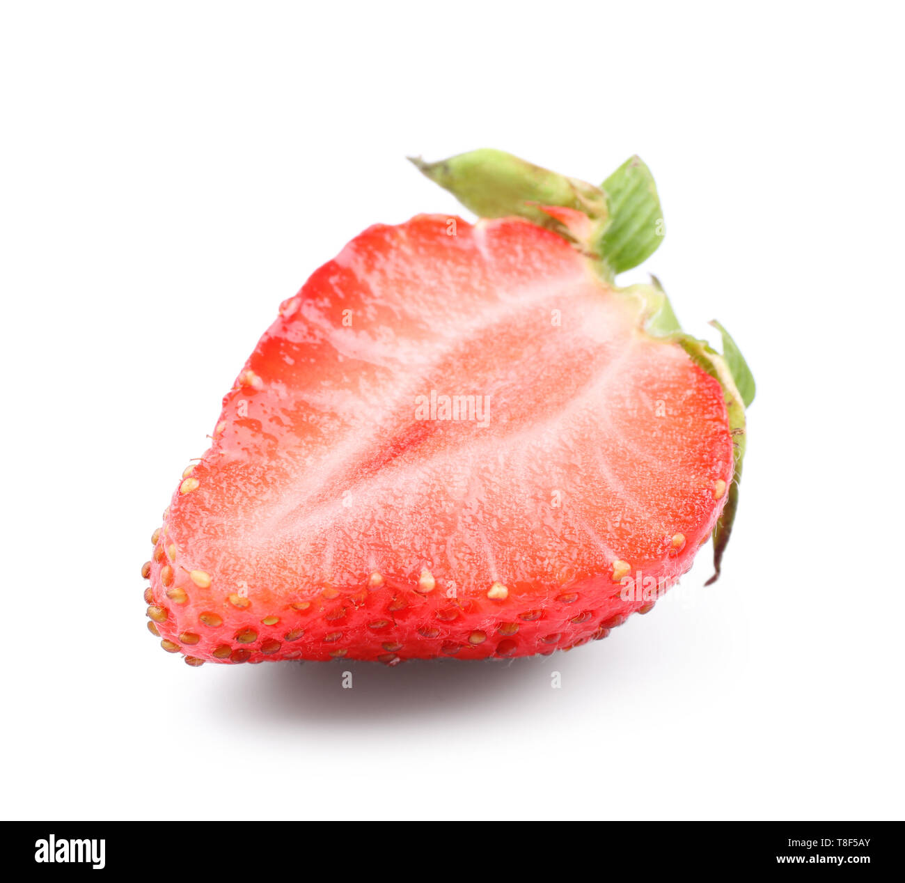 Half of ripe strawberry on white background Stock Photo - Alamy