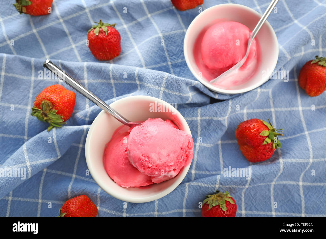 Bowls with delicious strawberry ice-cream on napkin Stock Photo - Alamy