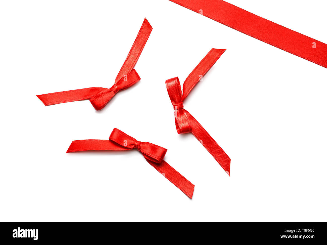 Red ribbon with beautiful bows on white background Stock Photo - Alamy
