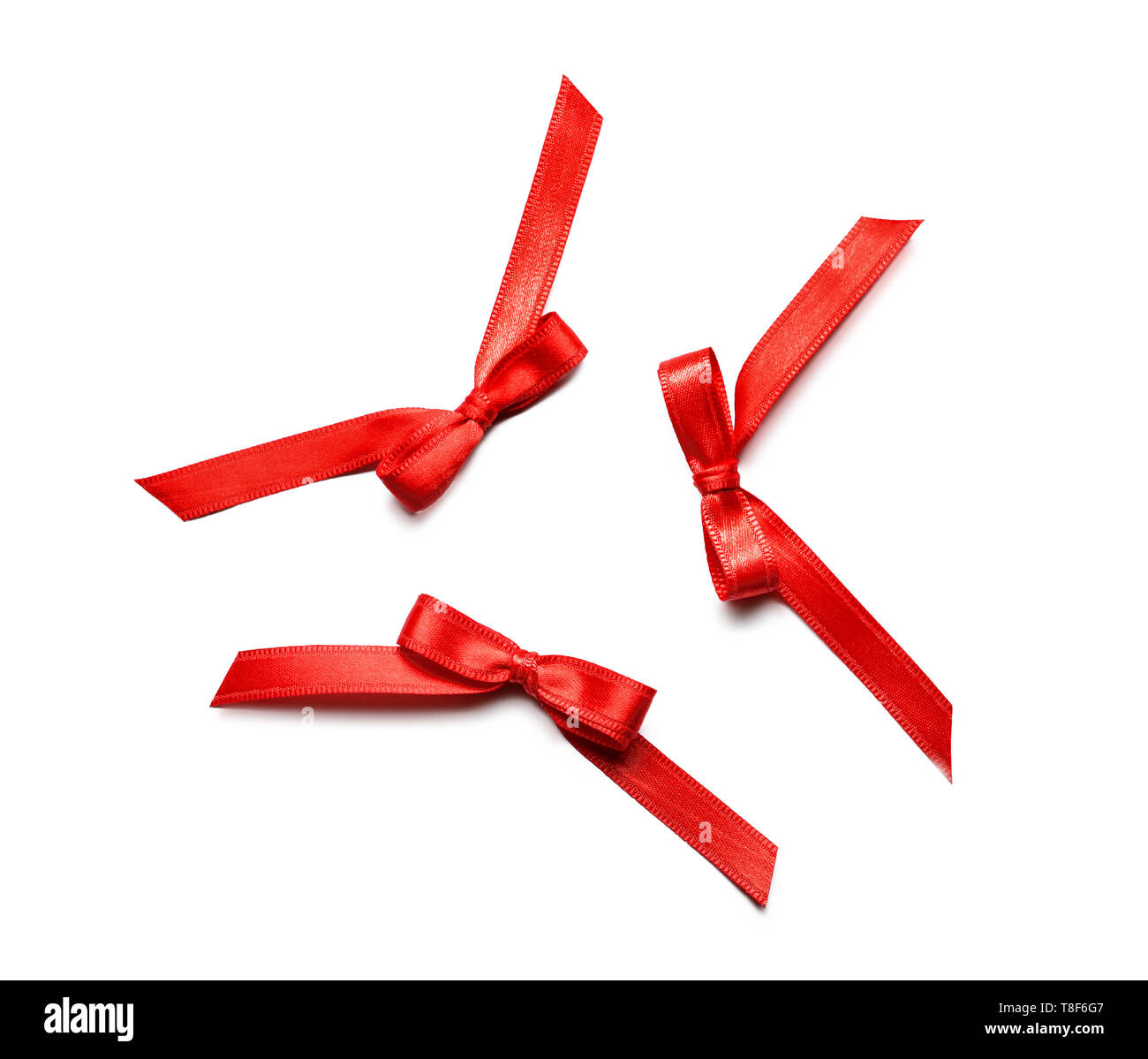 Beautiful bows made from red ribbon on white background Stock Photo - Alamy