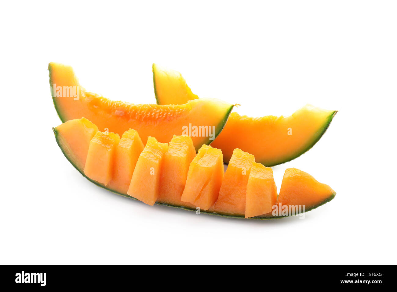 Tasty cut melon on white background Stock Photo - Alamy