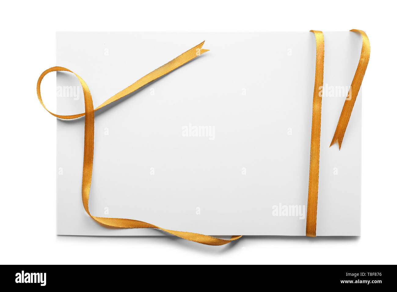Blank sheet of paper with golden ribbon on white background Stock Photo ...